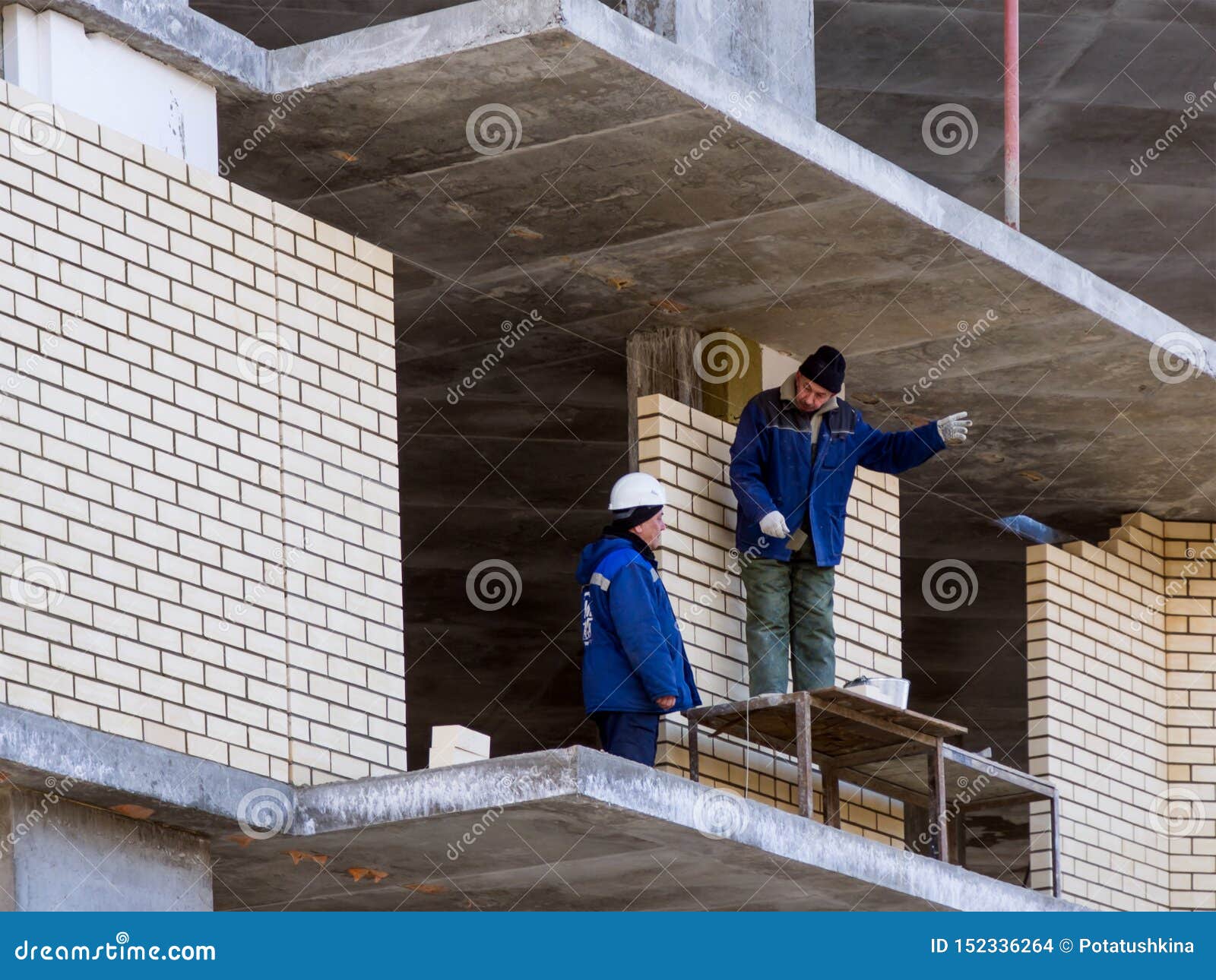 Conversation of Workers at a Construction Site Editorial Stock Image ...