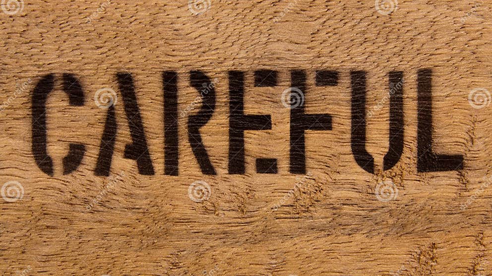 Vorsichtig auf Holz stockbild. Bild von sorgfältig, material - 20898949