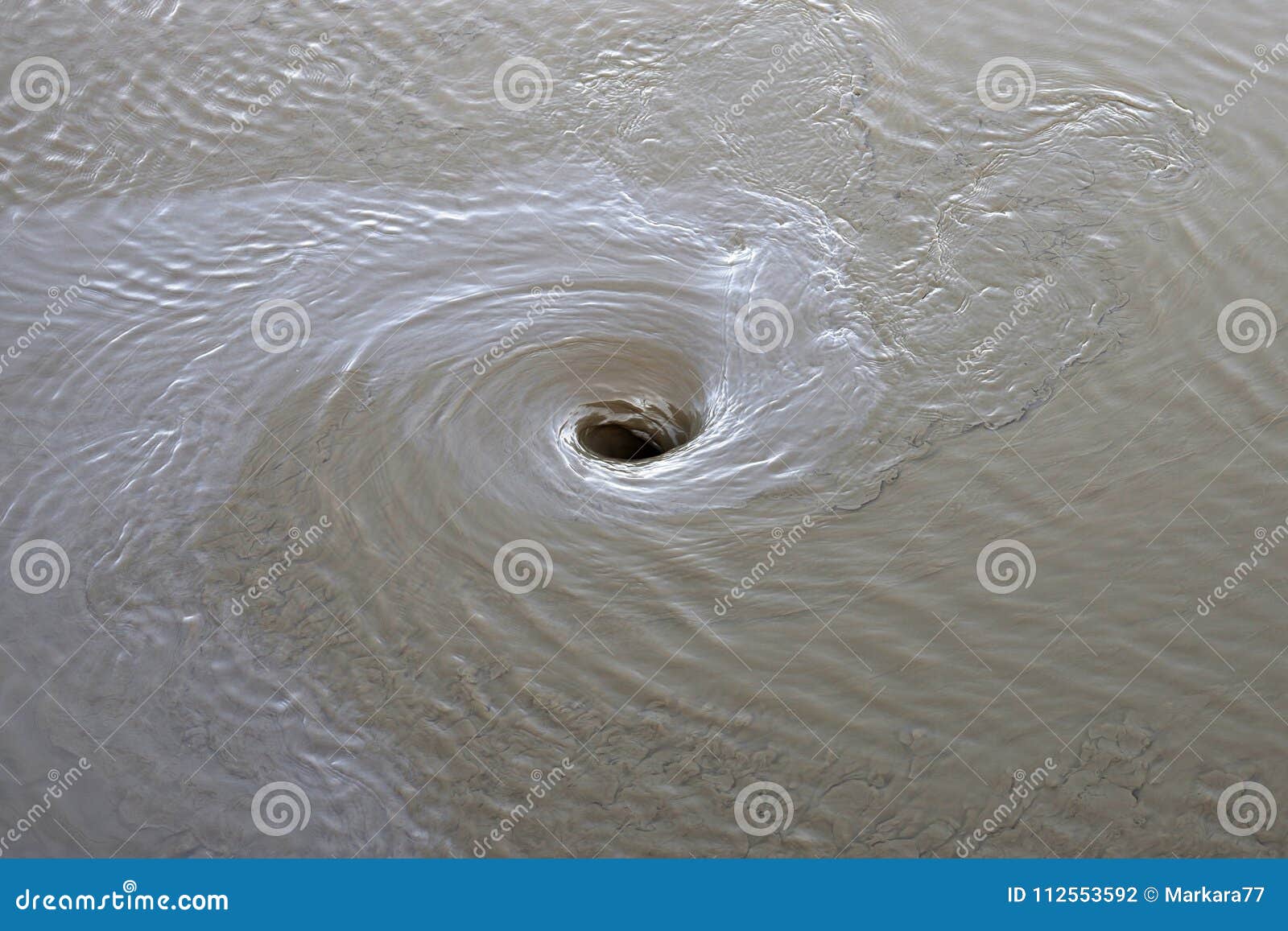 Vortex of muddy water. stock photo. Image of lake, flowing - 112553592