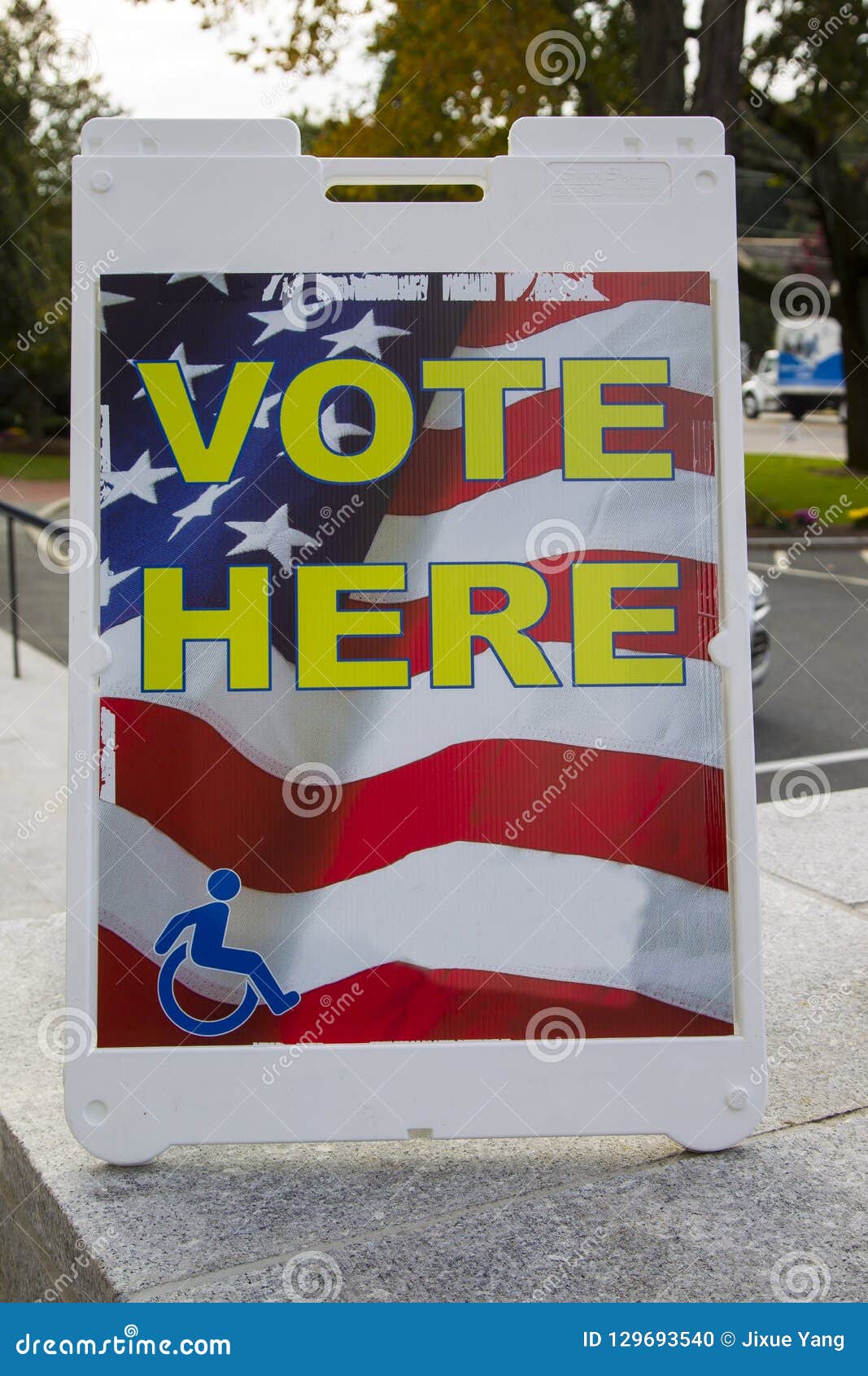 VOTING HERE Sign stock photo. Image of flag, polling - 129693540