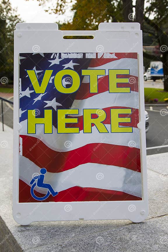 VOTING HERE Sign stock photo. Image of flag, polling - 129693540