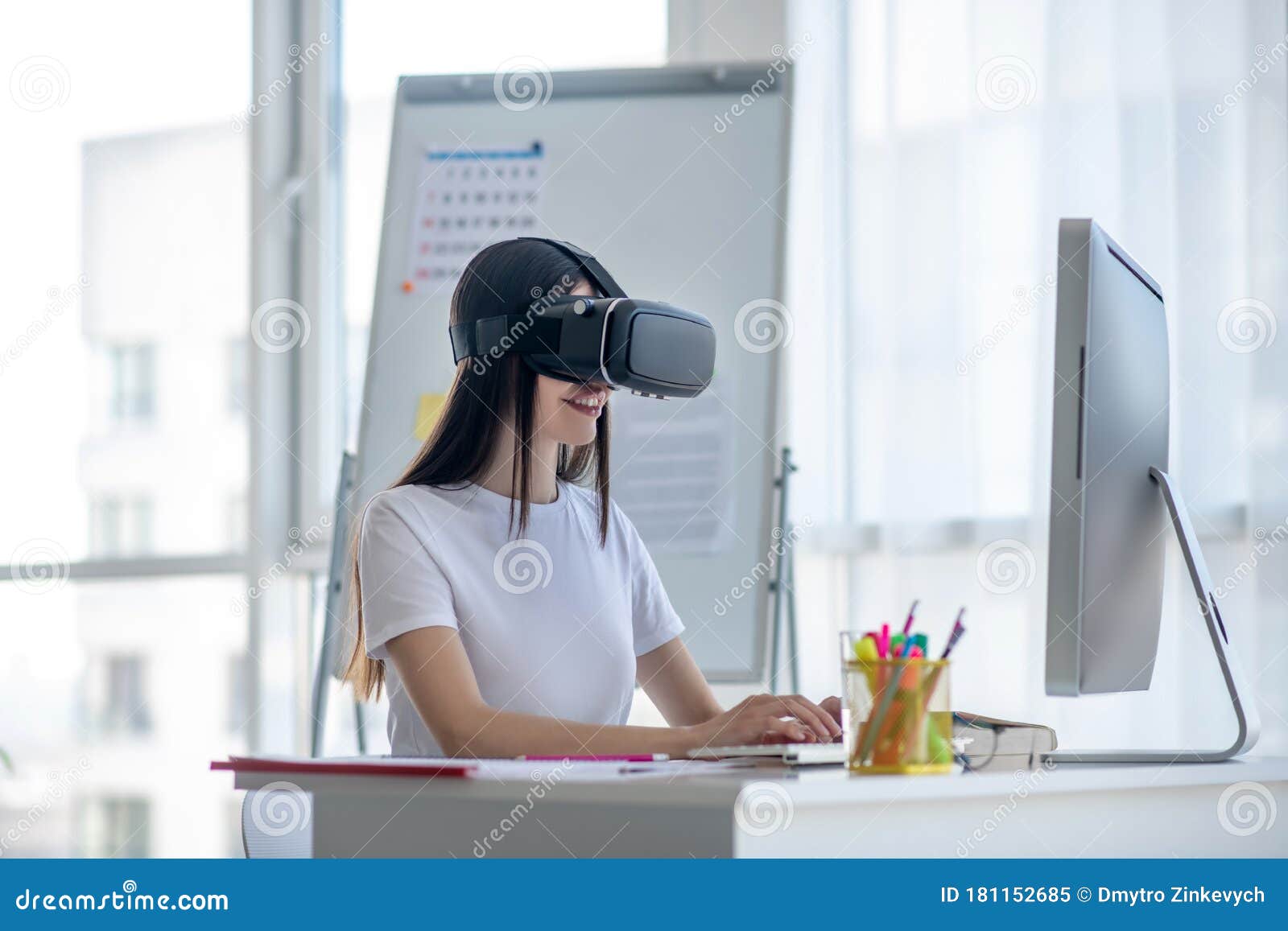 Dark-haired Girl Working at the Computer Wearing Vr Headset Stock Image ...