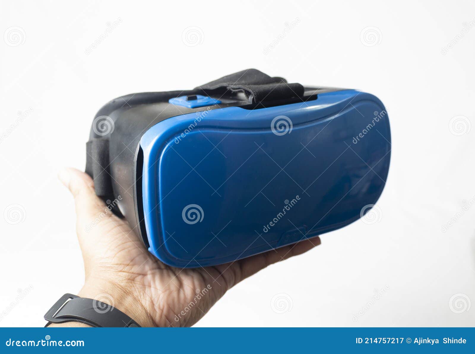 A VR Supporting Device Resting upon a Hand Against a White Background ...