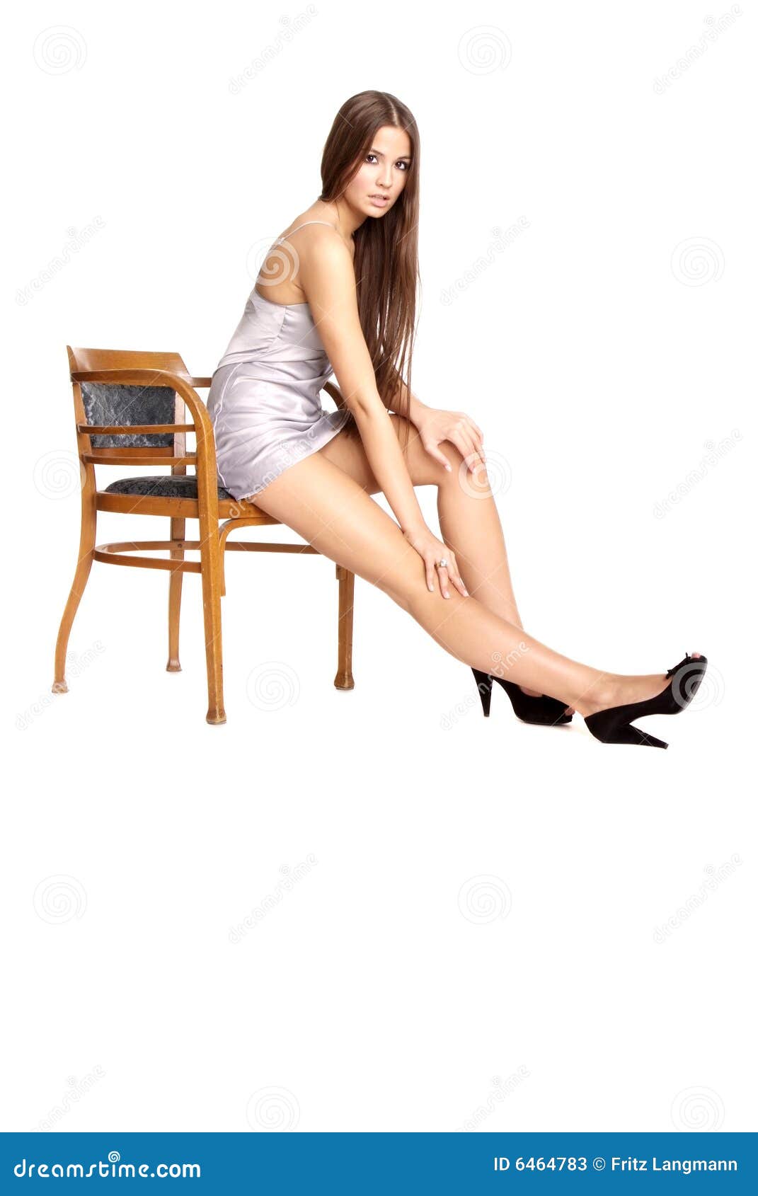 Vrouw op stoel stock afbeelding. Image of mooi, zeker - 6464783