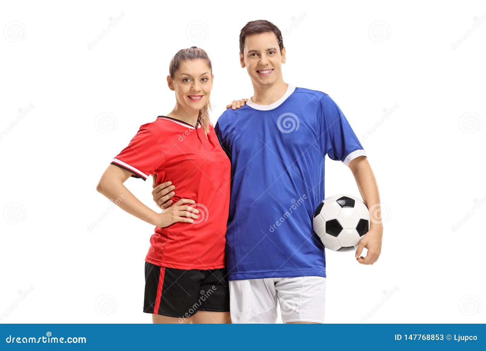 Vrouwelijke En Mannelijke Voetballers Met Een Voetbal Stock Afbeelding