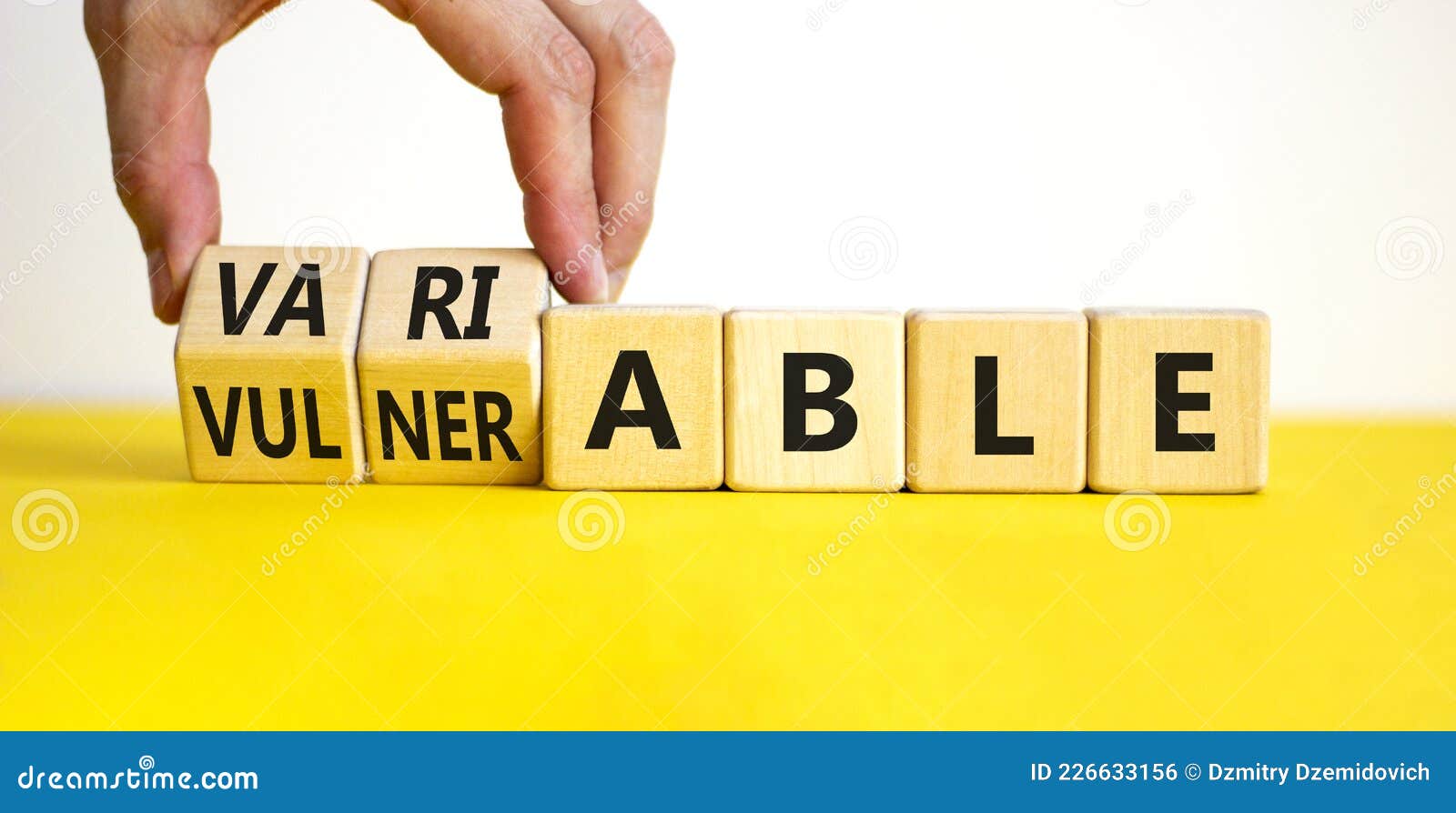 Vulnerable or Variable Symbol. Businessman Turns Wooden Cubes and ...