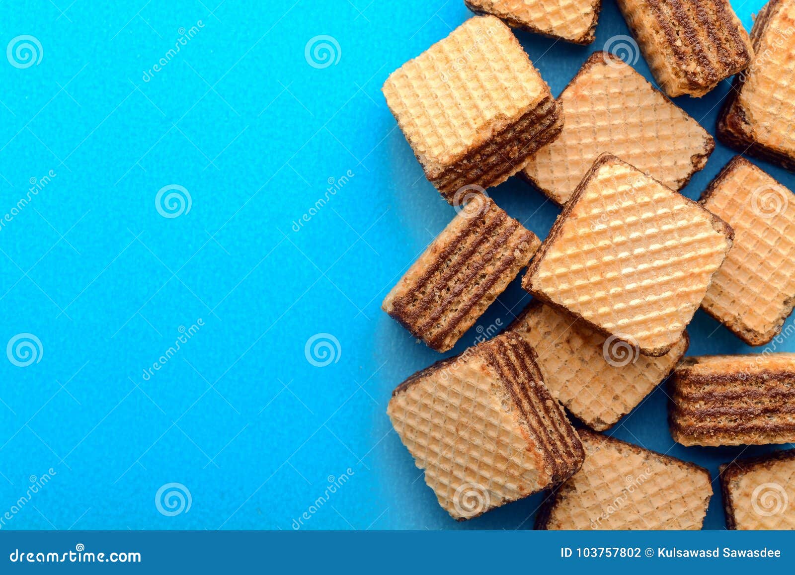 Wafer Filled with Cocoa Cream on Blue Paper Background Stock Photo ...