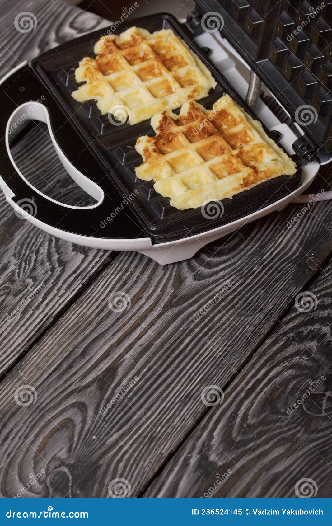 Waffle Maker with Waffles. on Black Pine Boards Stock Image - Image of ...