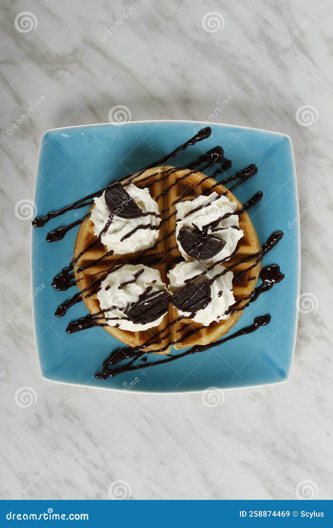 Waffles With Chocolate Cookie Sandwich Chocolate Syrup And Whipped