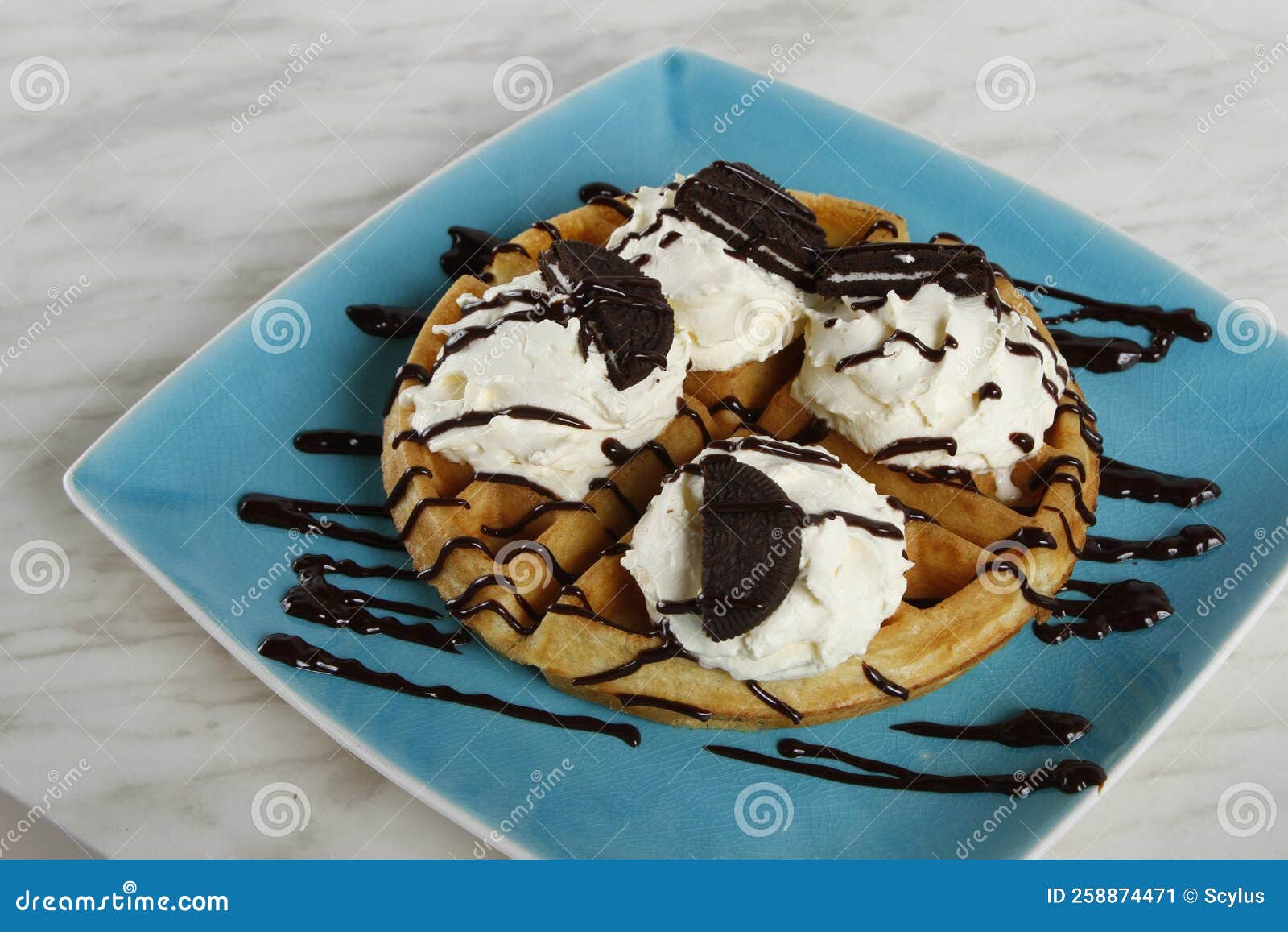 Waffles With Chocolate Cookie Sandwich Chocolate Syrup And Whipped