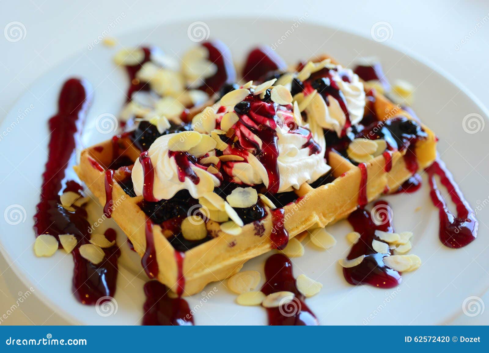 Waffles with fruit sauce stock photo. Image of belgian - 62572420
