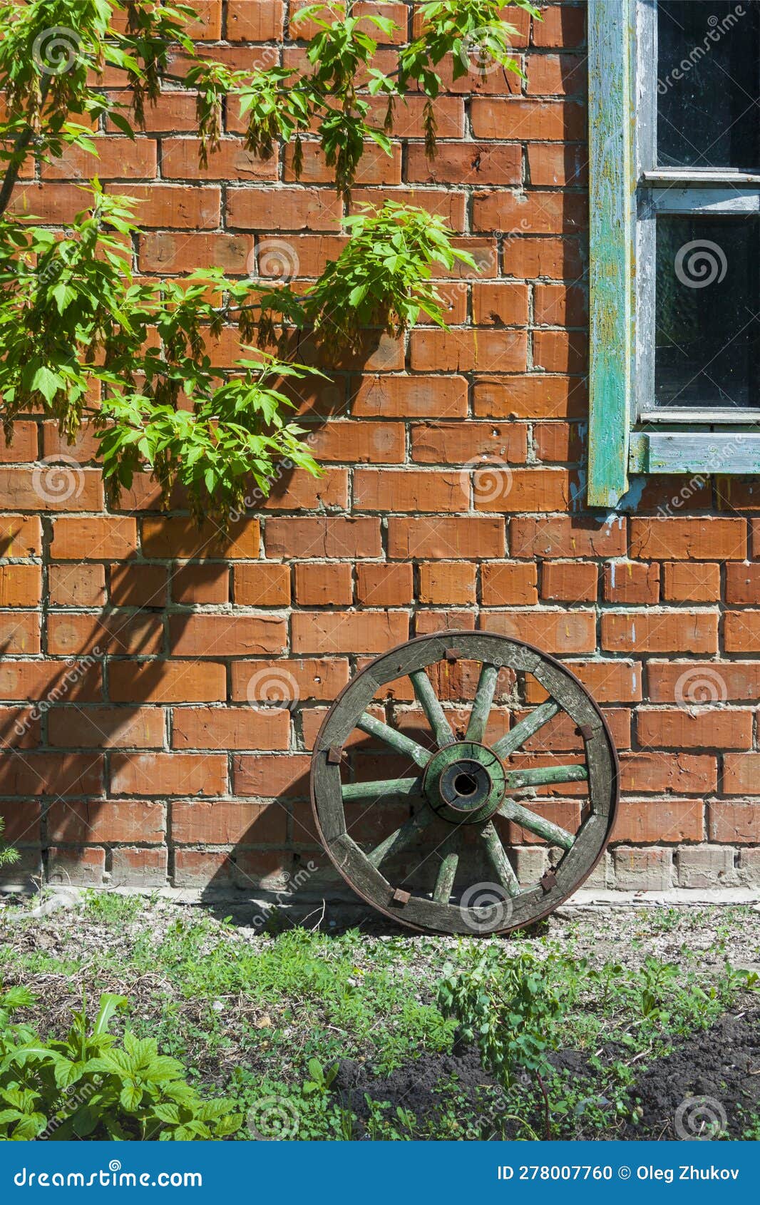Wagon Wheel Against a Brick Wall Stock Photo - Image of wooden ...