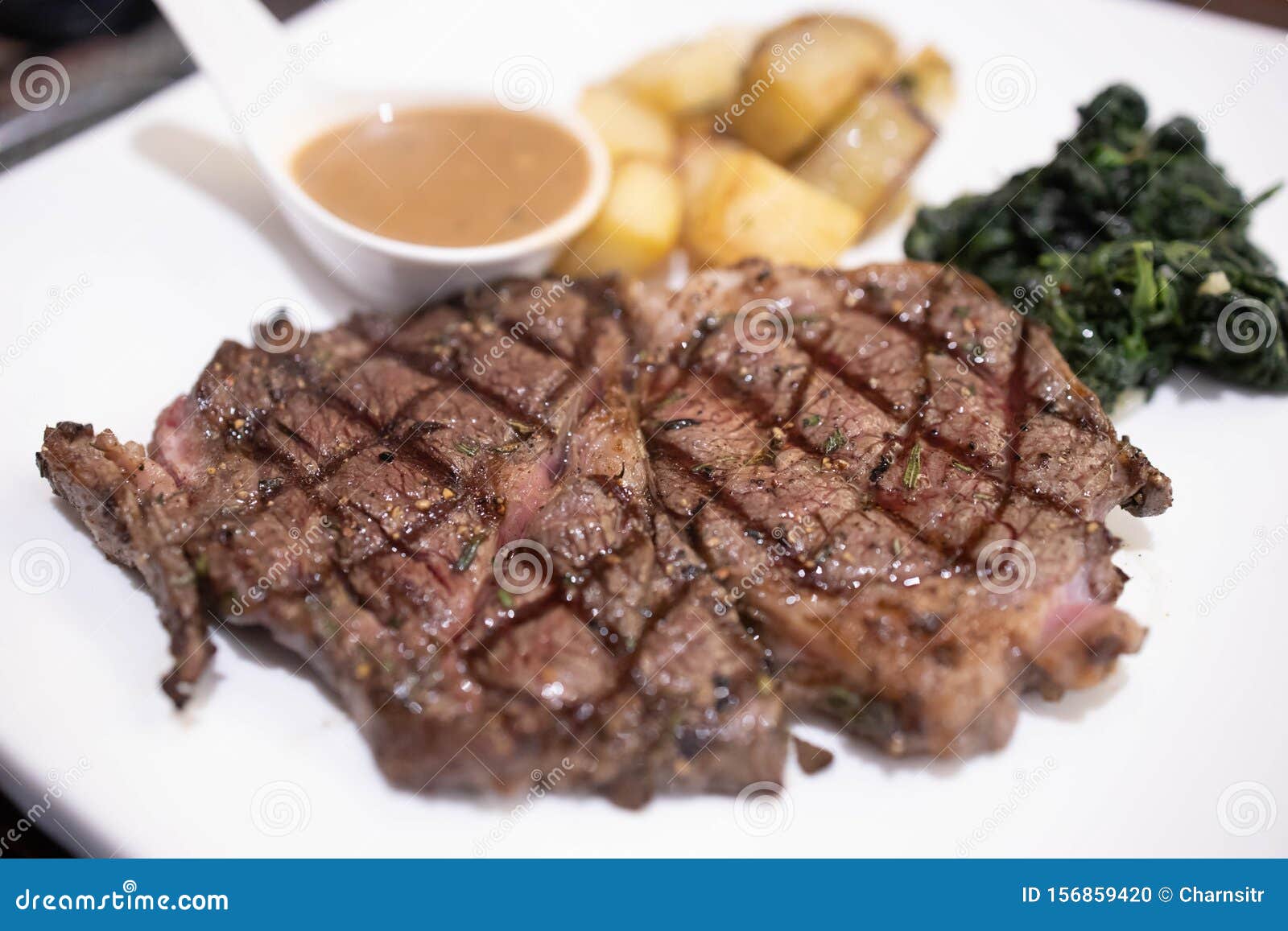 Ribeye steak on a plate stock photo. Image of meat, roasted - 156859420