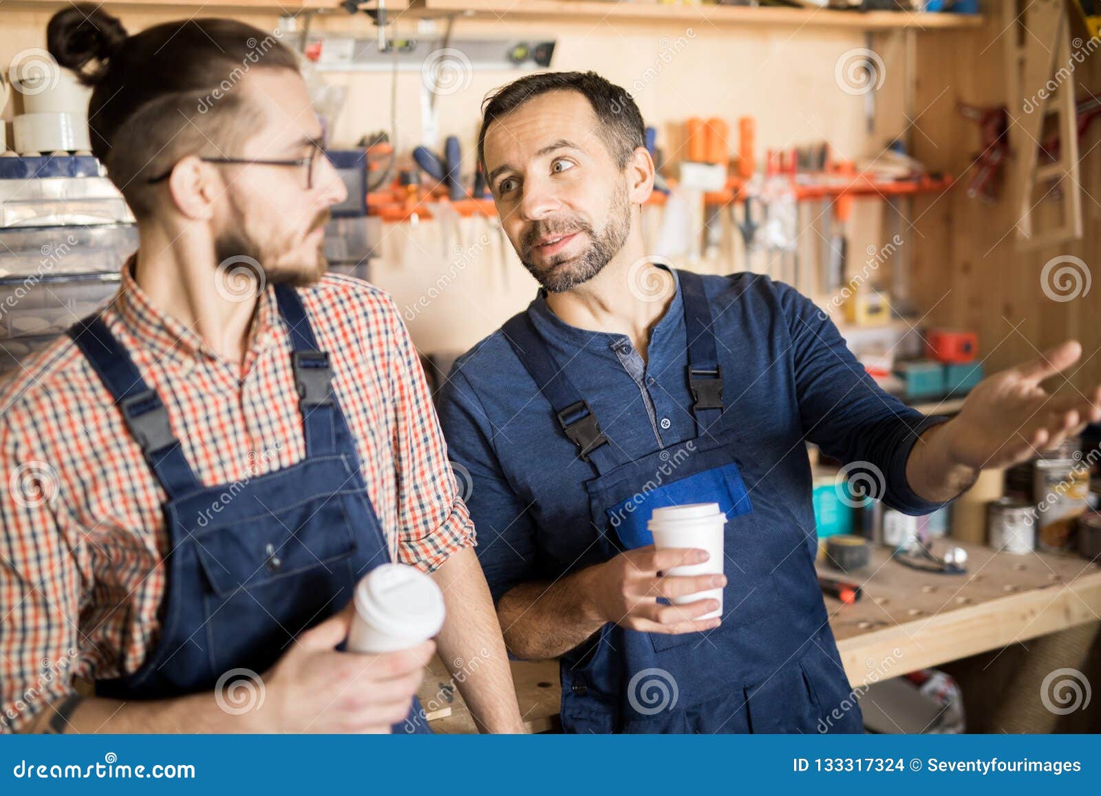Workers Chatting at Break stock photo. Image of creative - 133317324