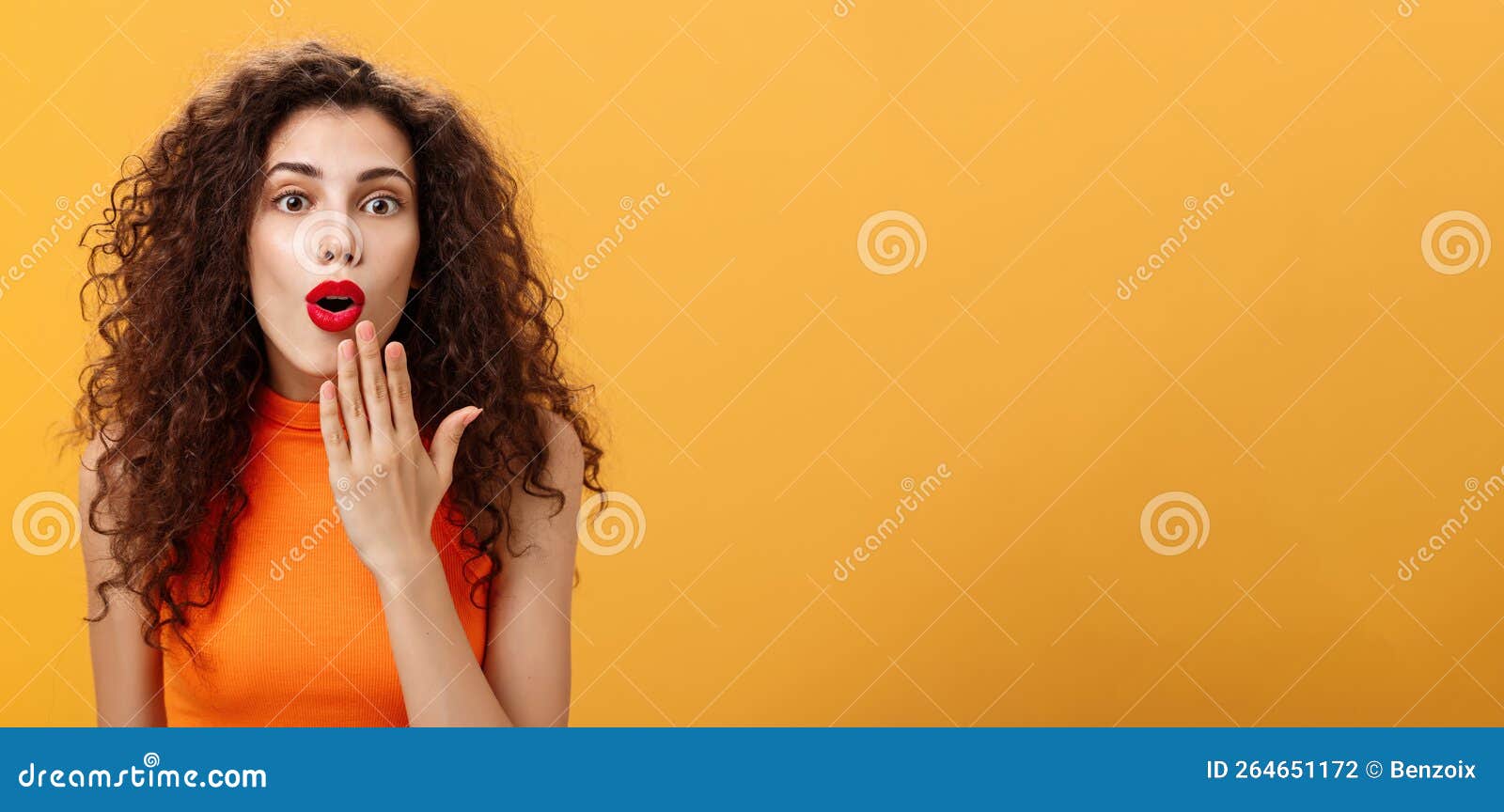 Waist Up Shot Of Amazed And Excited Caucasian Woman With Curly Hair In