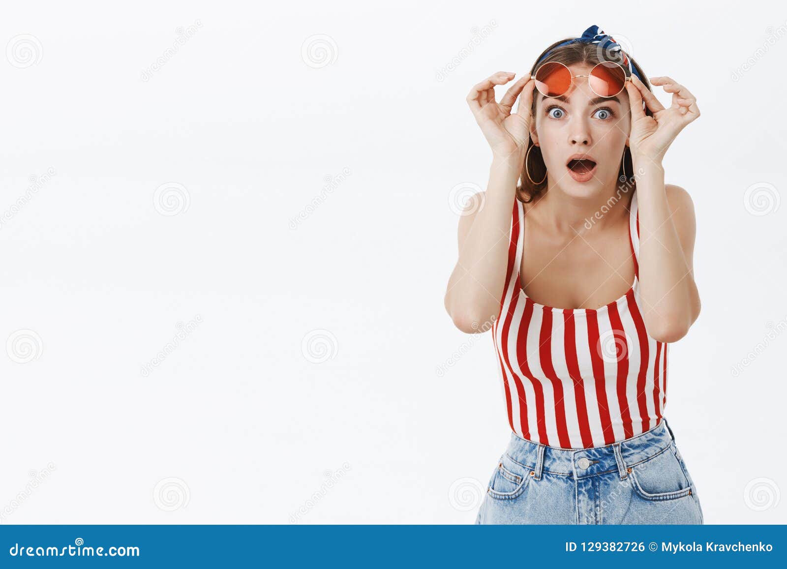 Waist Up Shot Of Amazed Stunned Attractive Fashionable Woman In Striped