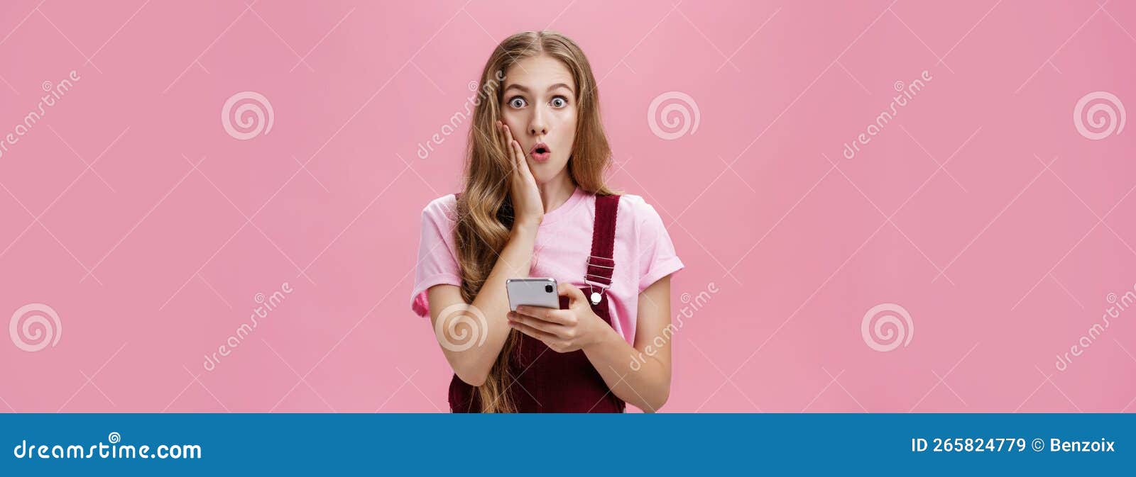 Waist Up Shot Of Surprised Amazed Stunned Young Slender Woman With Wavy
