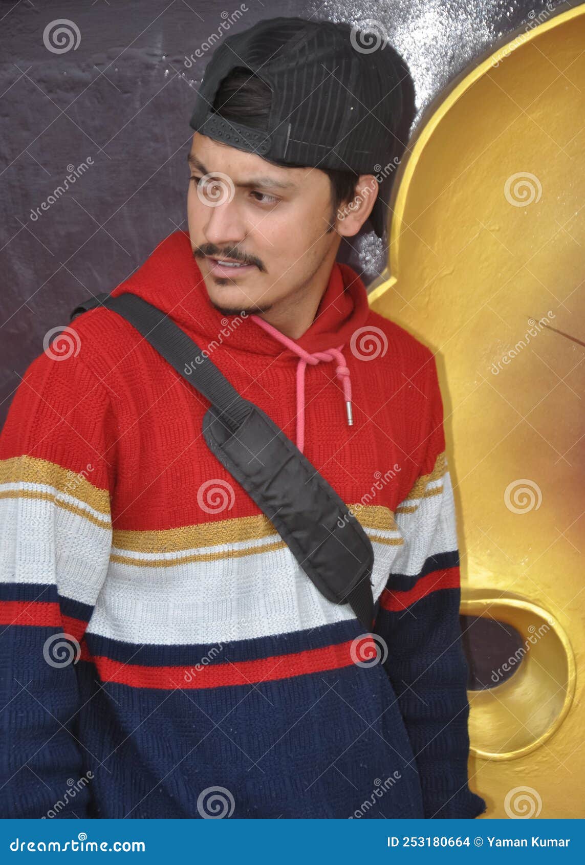Waist-up of a Young Guy Wearing Cap Backwards with Looking Sideways ...