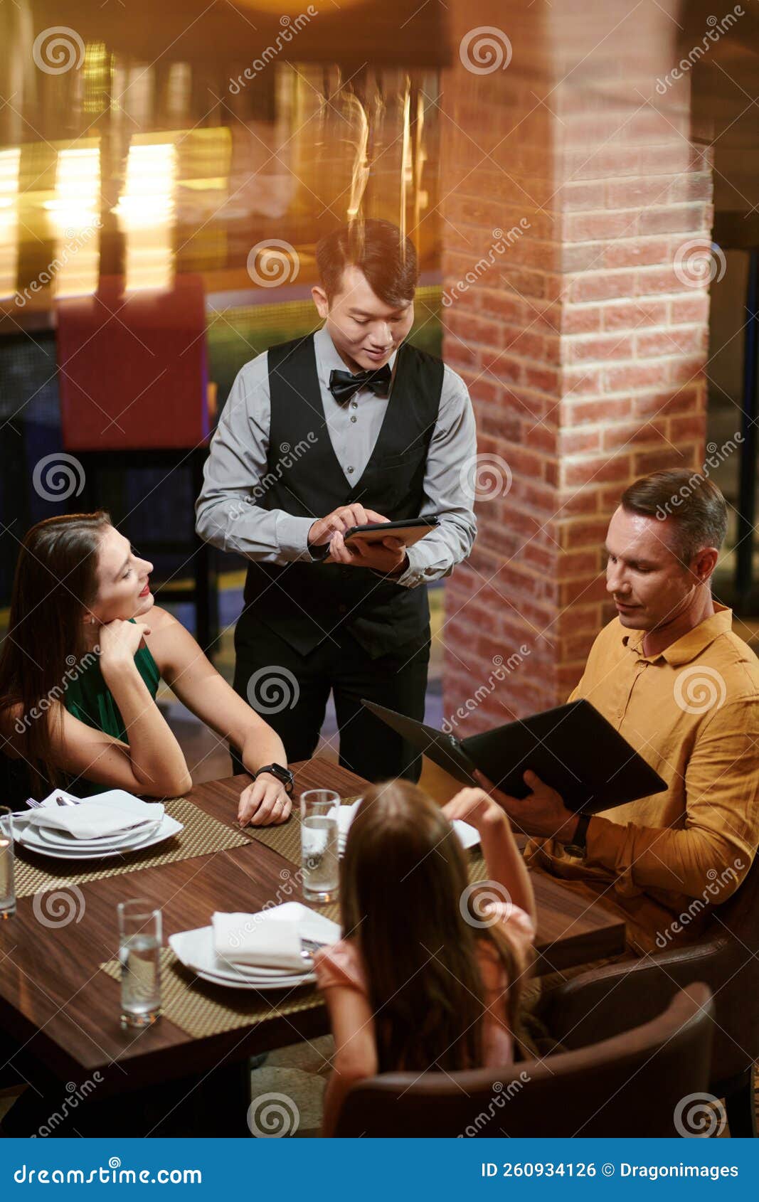Waiter Accepting Order stock photo. Image of manu, talking - 260934126