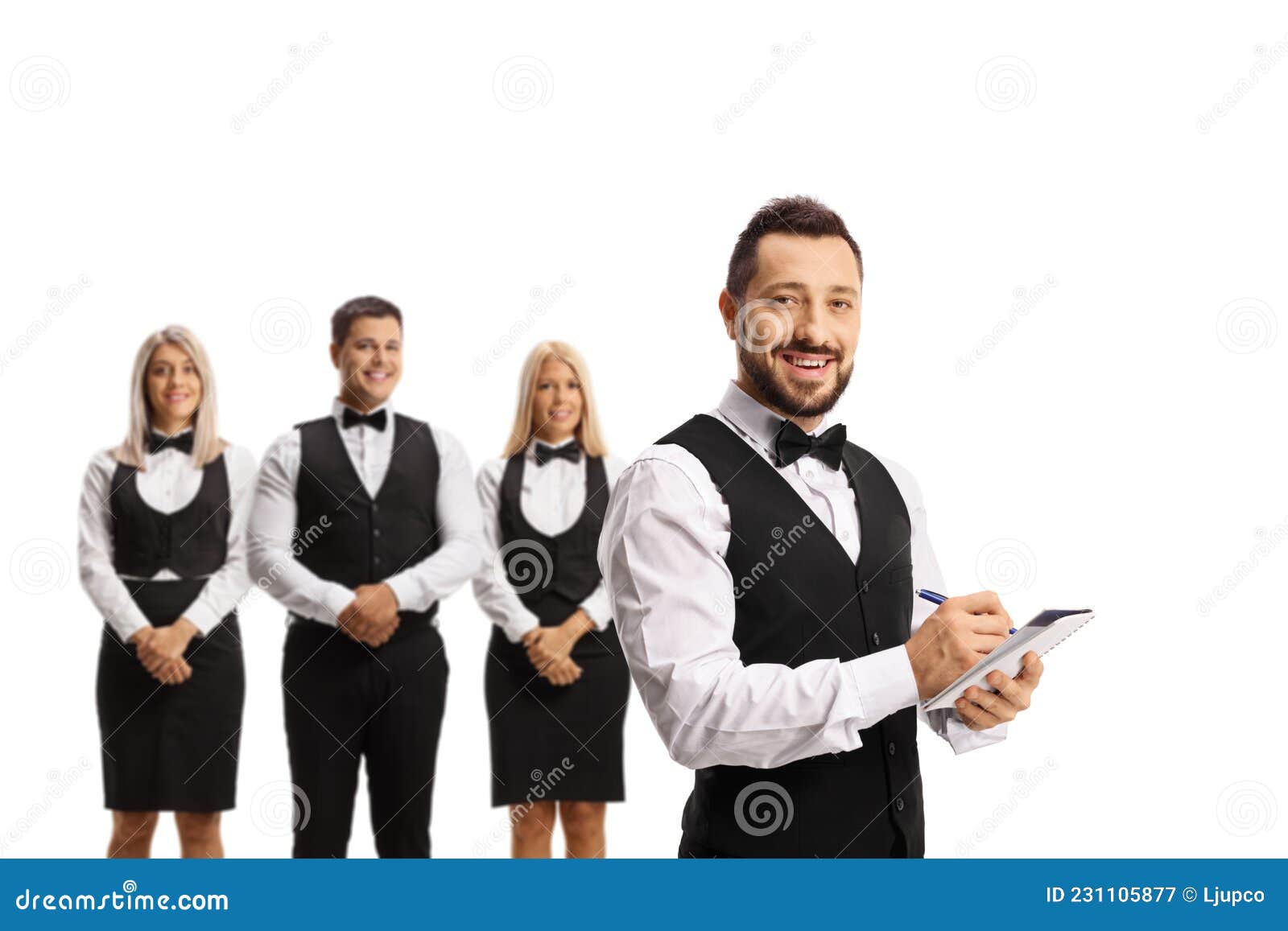Waiter with a Bow Tie Writing and Other Waiters Standing in the Back ...