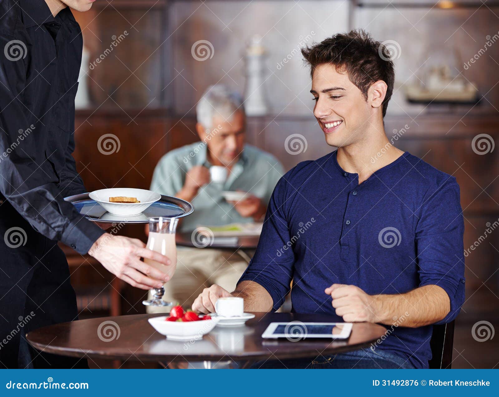 Waiter Bringing Man a Cocktail Stock Photo - Image of happy, staff ...