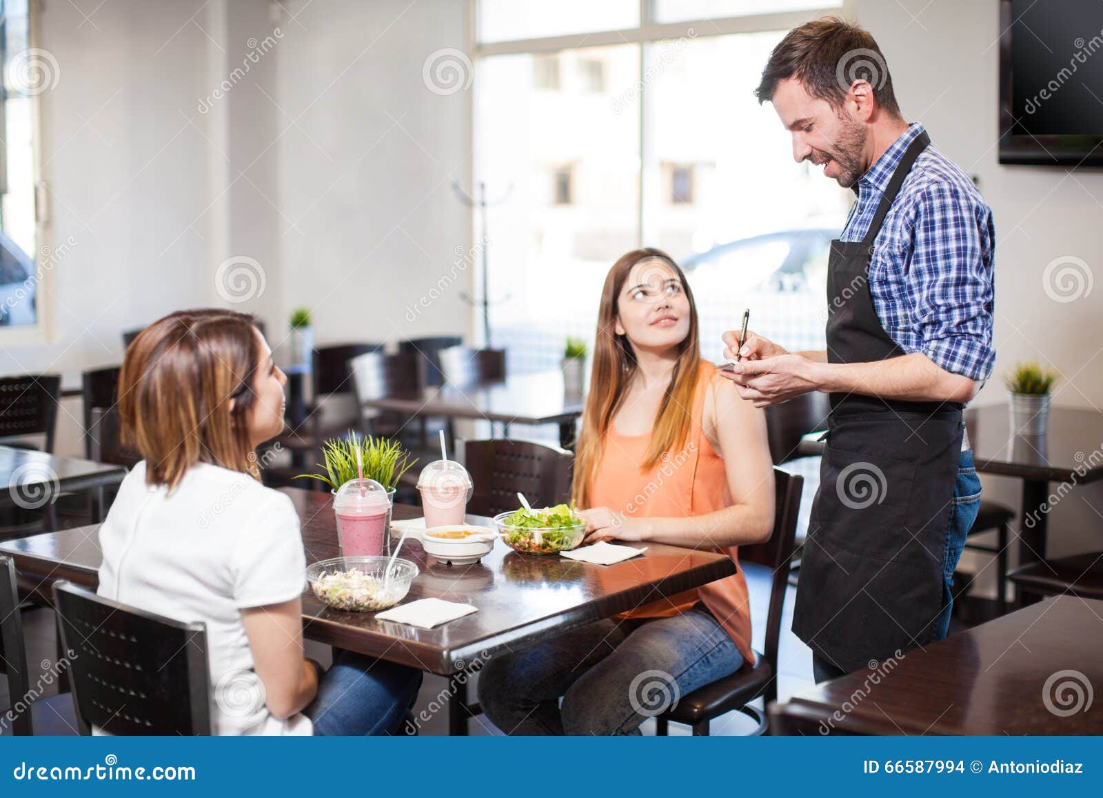Waiter Checking Up on His Customers Stock Photo - Image of meal ...