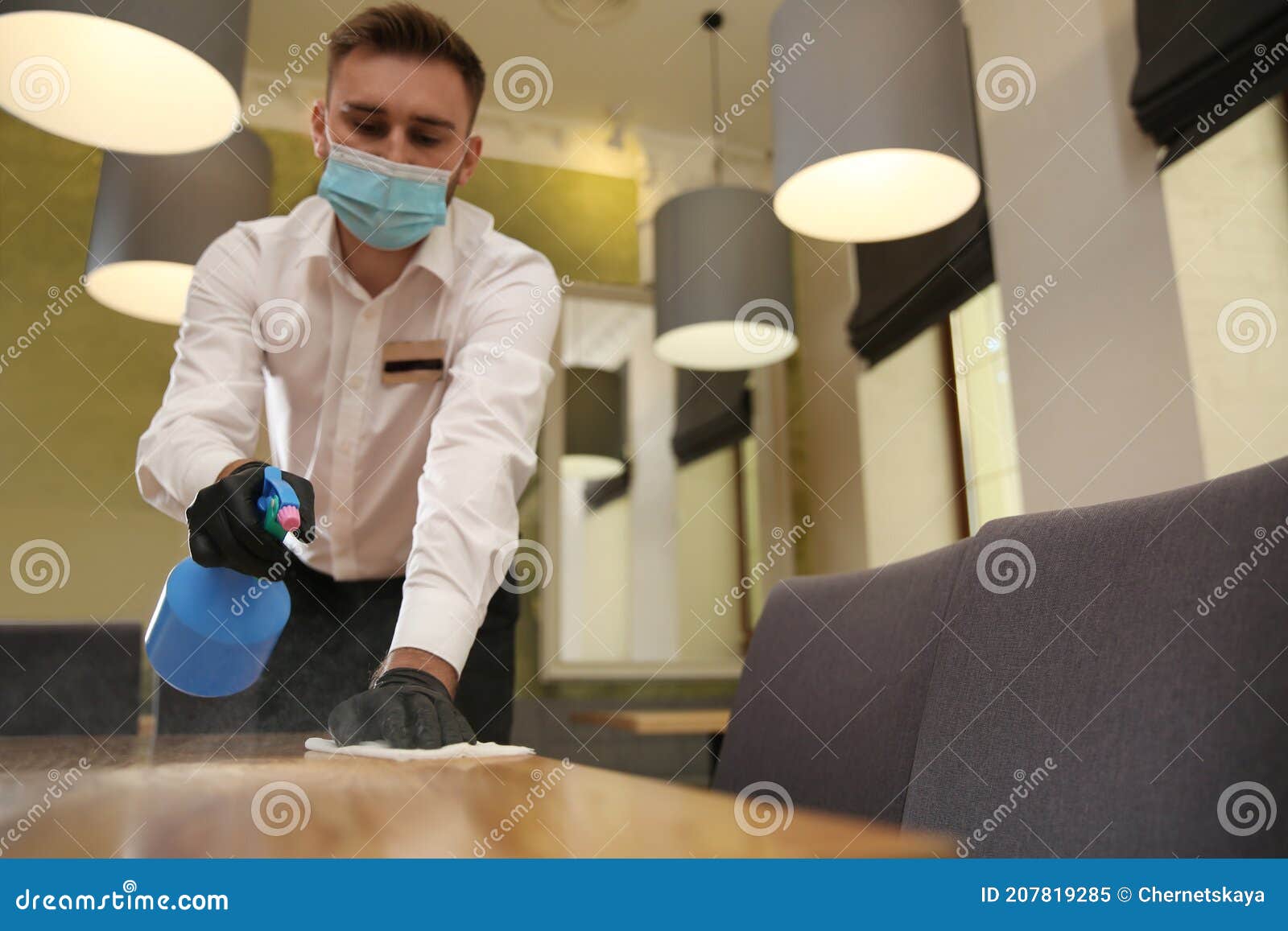 Waiter Cleaning Table with Rag and Detergent in Restaurant. Surface ...