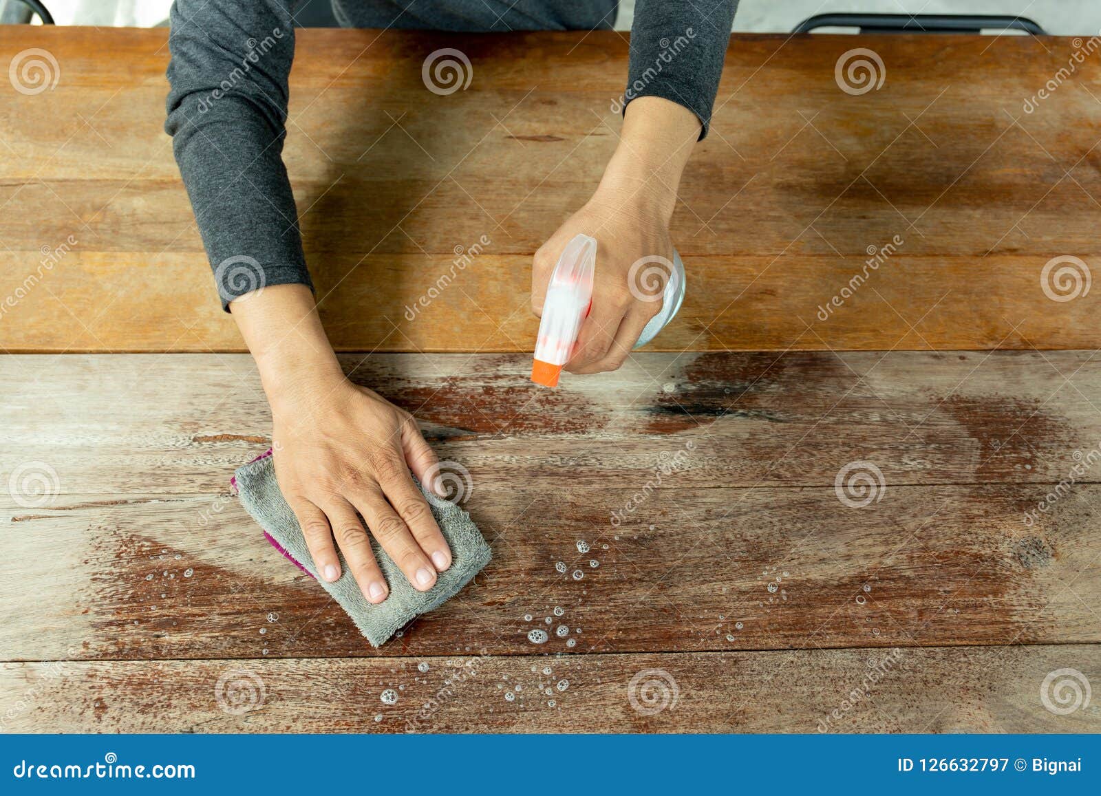 Waiter Cleaning the Table with Spray Disinfectant in Cafe. Stock Image ...
