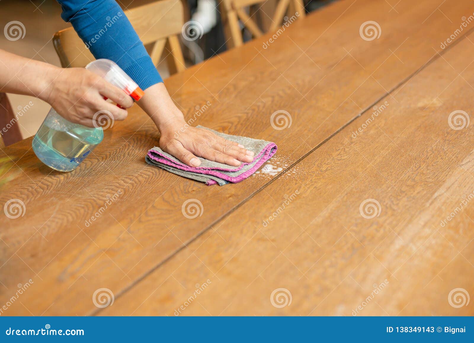 Waiter Cleaning the Table with Spray Disinfectant on Table in ...