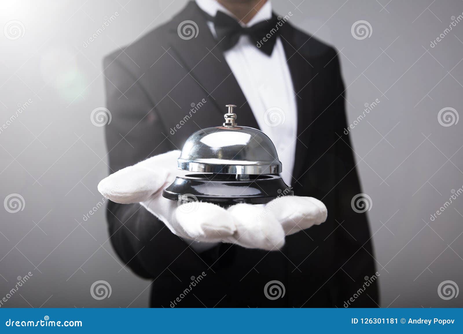 Waiter Holding Service Bell Stock Image - Image of hand, closeup: 126301181