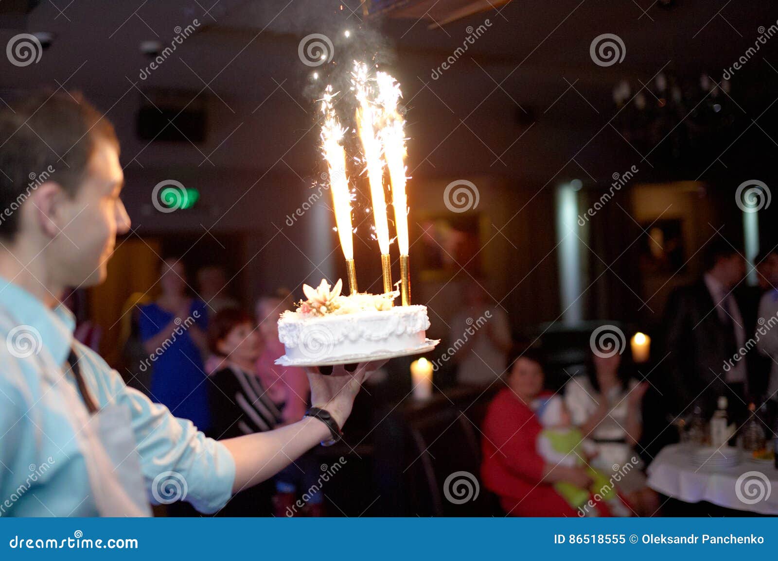 Waiter Introducing a Birthday Cake with the Firework in the Ball ...
