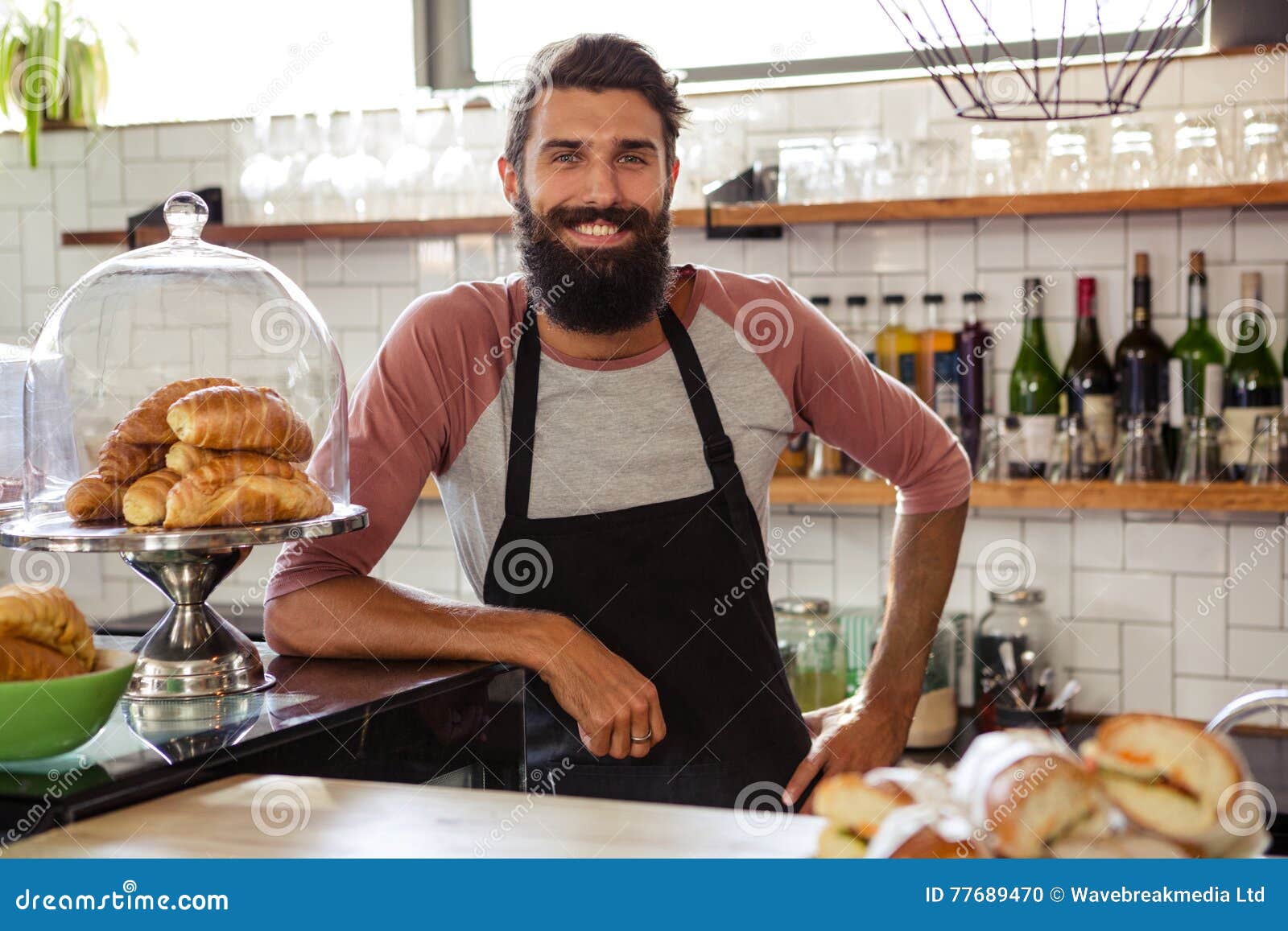 Waiter Leaning Against Counter Stock Photo - Image of apron ...