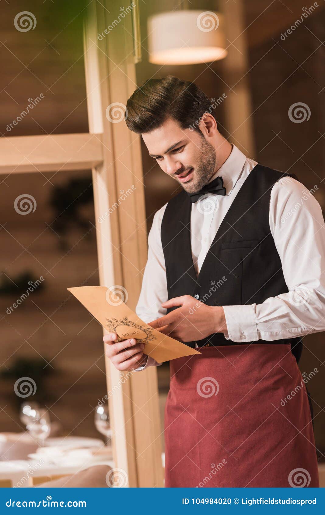 Waiter looking at menu stock photo. Image of wooden - 104984020