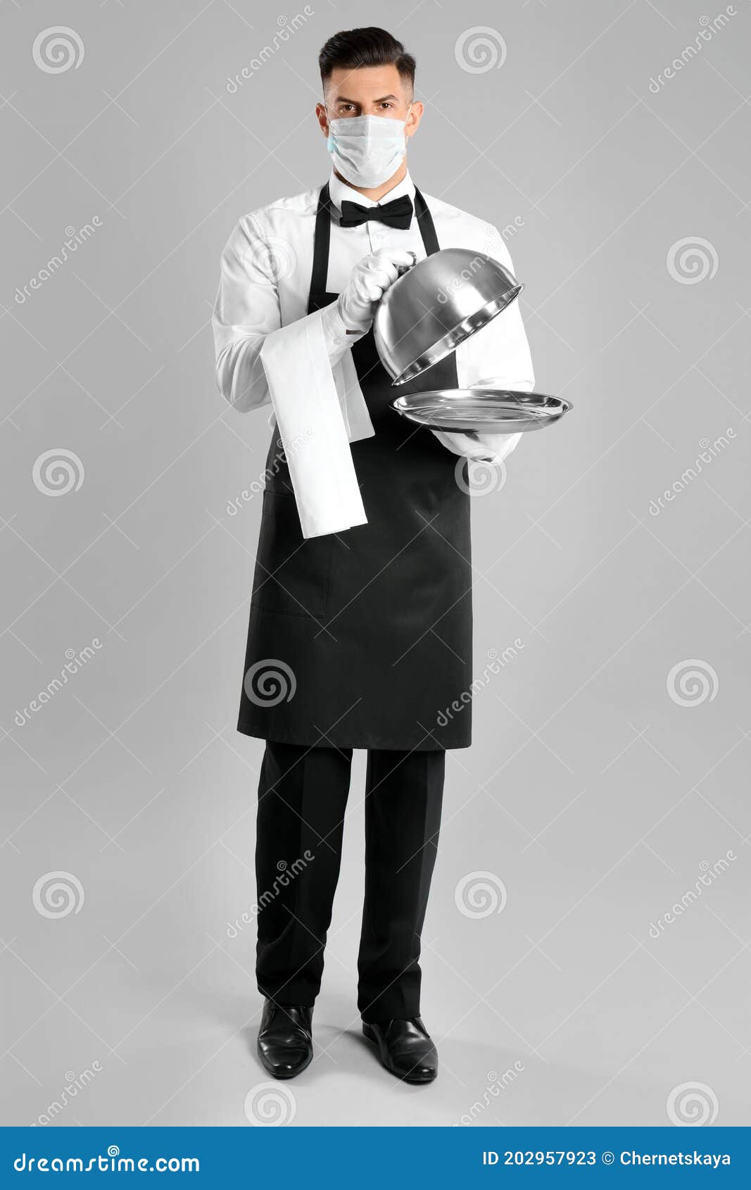 Waiter in Medical Face Mask with Empty Tray on Light Grey Background ...