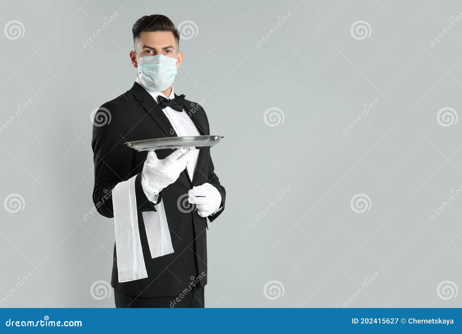 Waiter in Medical Face Mask with Empty Tray on Light Grey Background ...