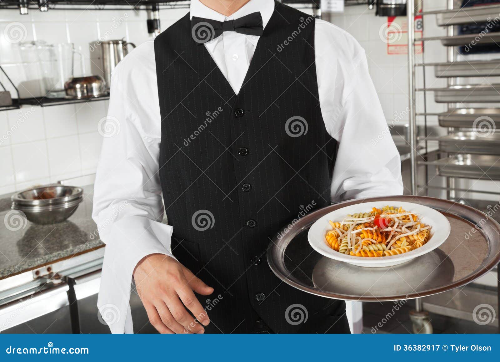Waiter with Pasta Dish stock image. Image of indoor, restaurant - 36382917