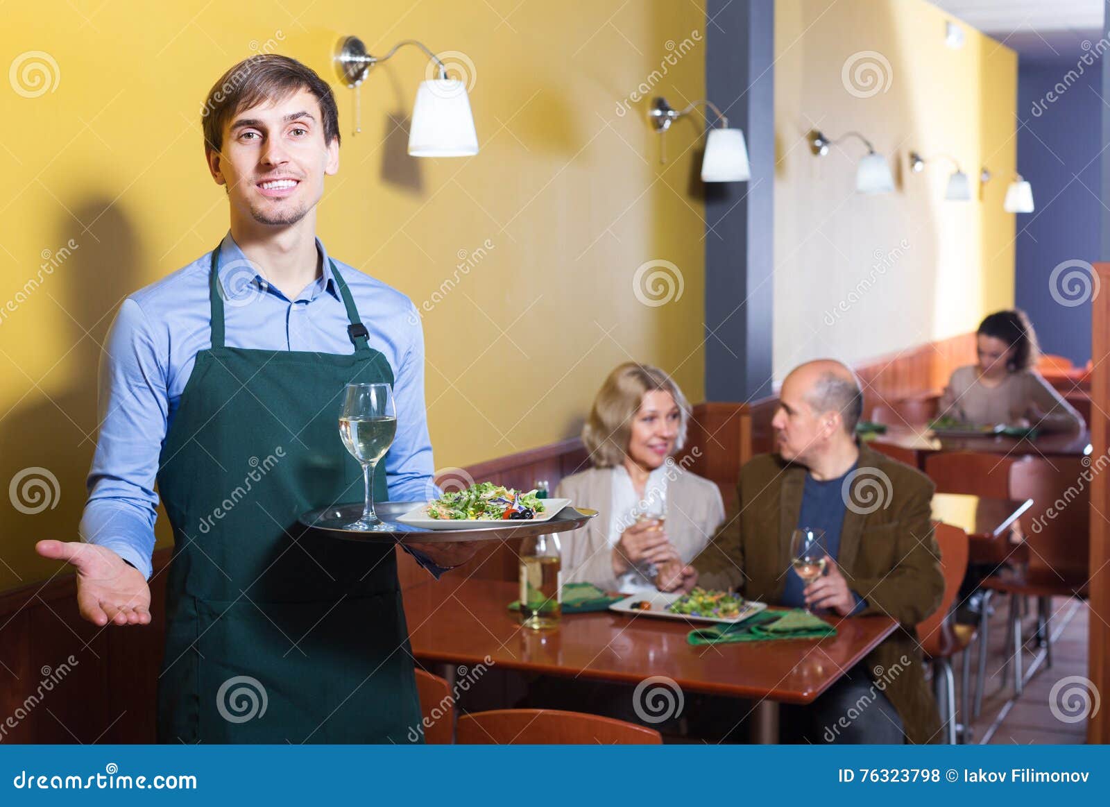 Waiter Posing at Table Customers Stock Photo - Image of glass, couple ...