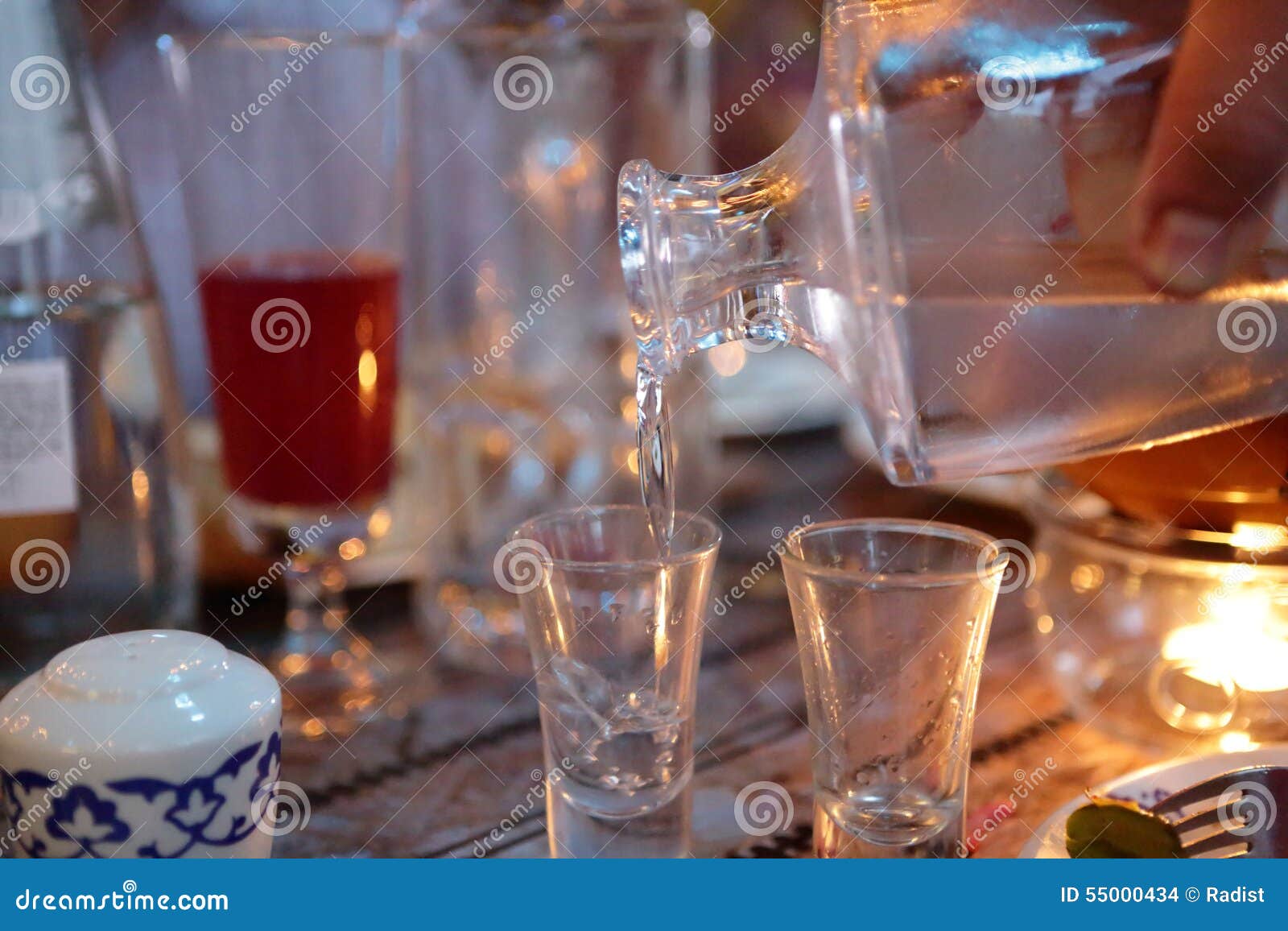 Waiter pouring vodka stock photo. Image of appetizer - 55000434