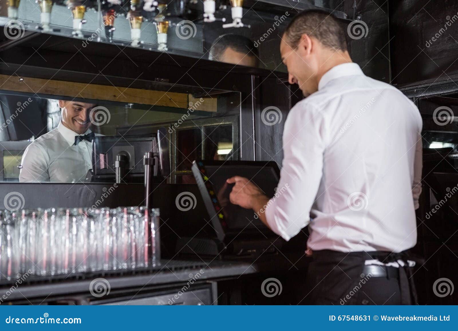 Waiter preparing a bill stock image. Image of payment - 67548631
