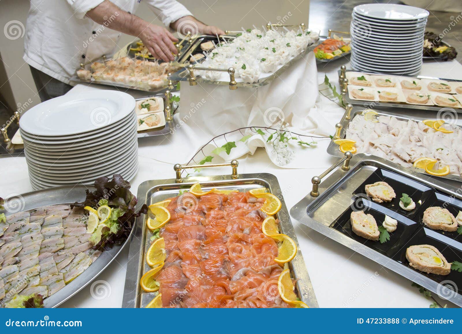 Waiter Preparing Wedding Buffet Stock Photo - Image of preparing, dish ...