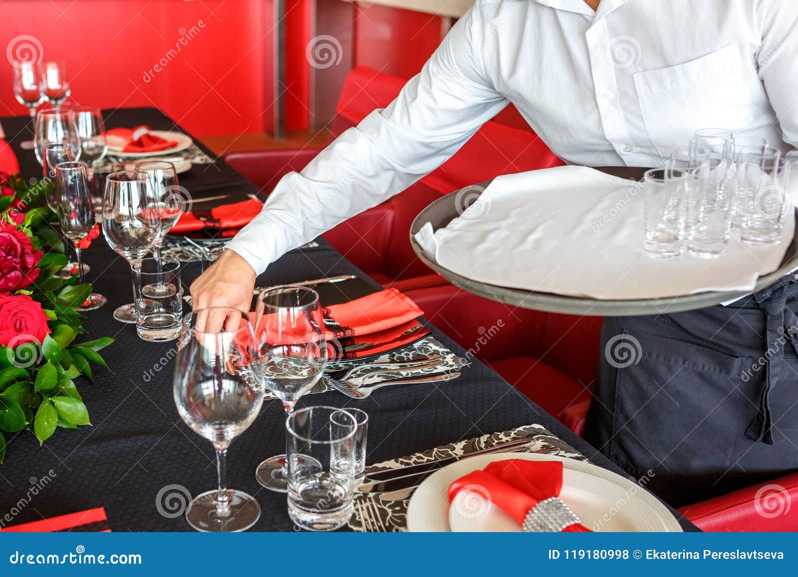 The Waiter Puts Cutlery on the Holiday Table Stock Photo - Image of ...