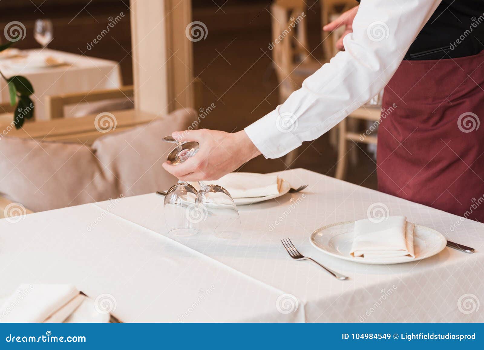 Waiter Putting Pile Of Plates On Table Stock Photo | CartoonDealer.com ...