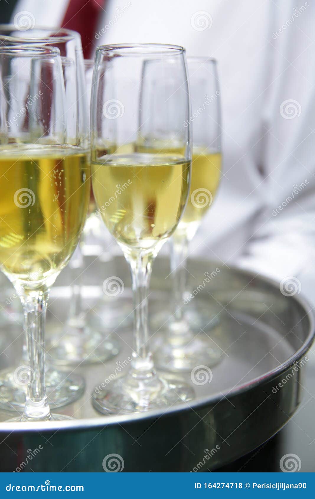 A Waiter Serving Champagne on a Tray at an Event. Stock Photo - Image ...
