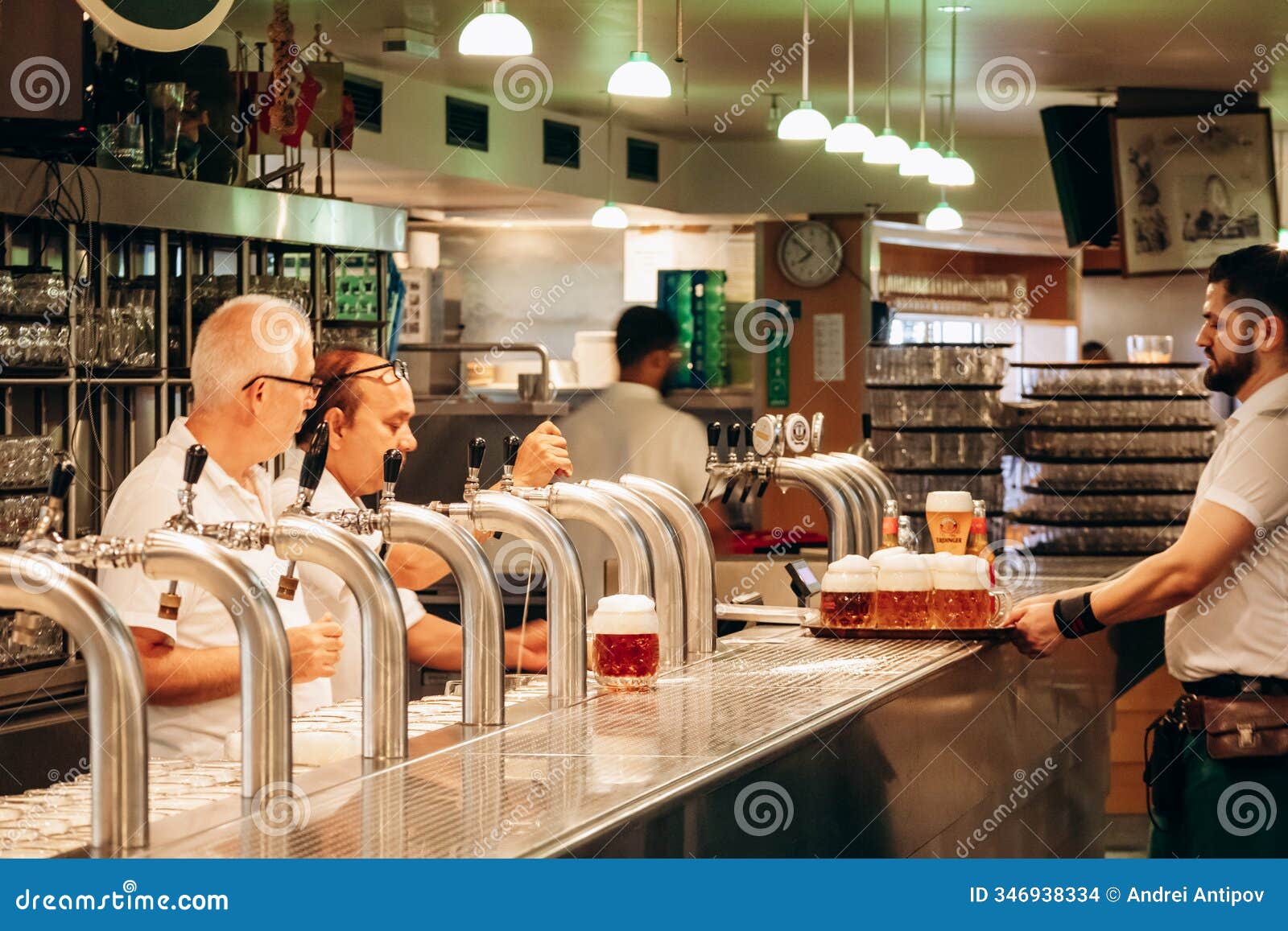 Waiter Serves A Glass Of Italian Beer Nastro Azzurro With Mexican ...