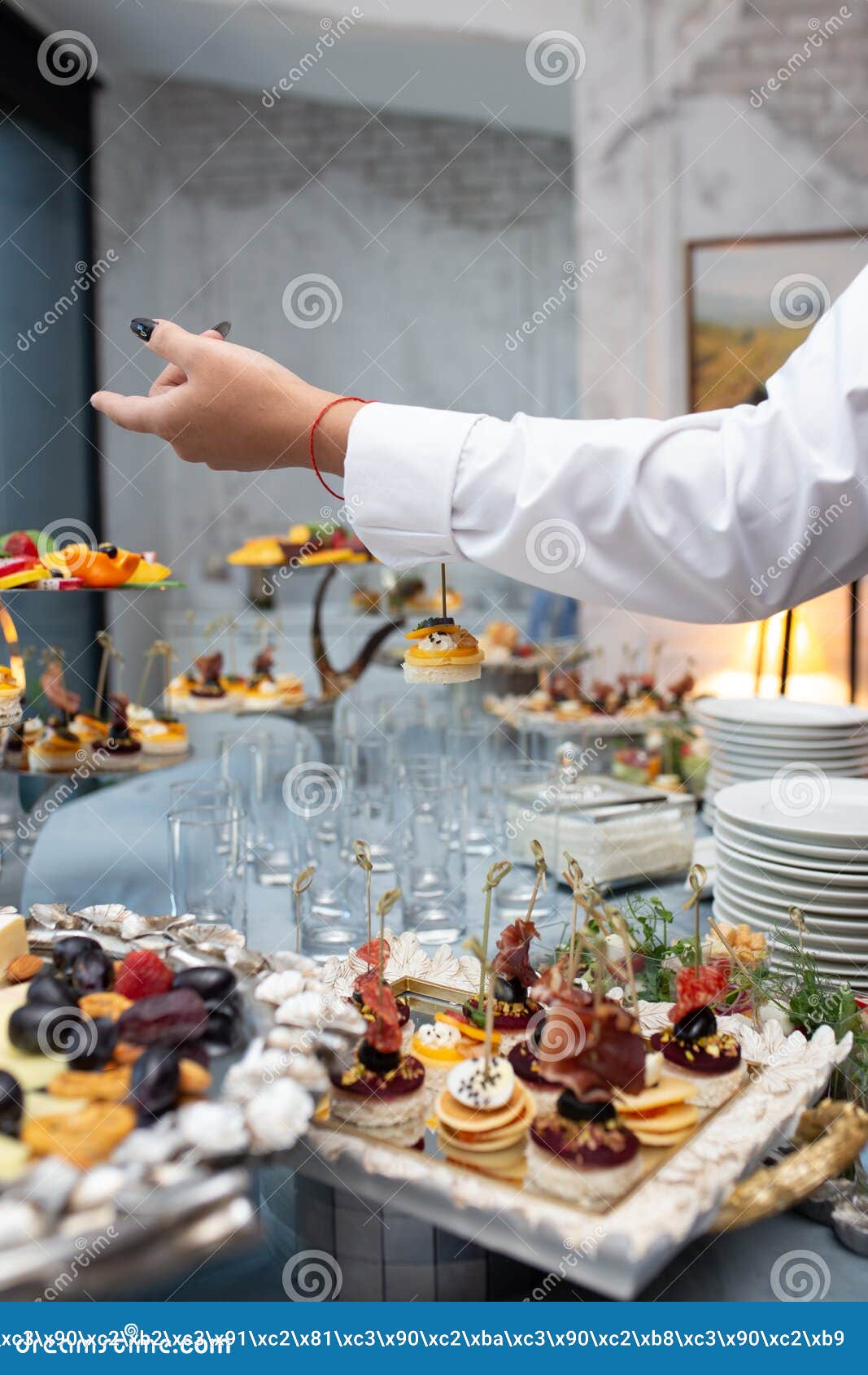 A Waiter Serves a Buffet Table at the Event Stock Photo - Image of ...