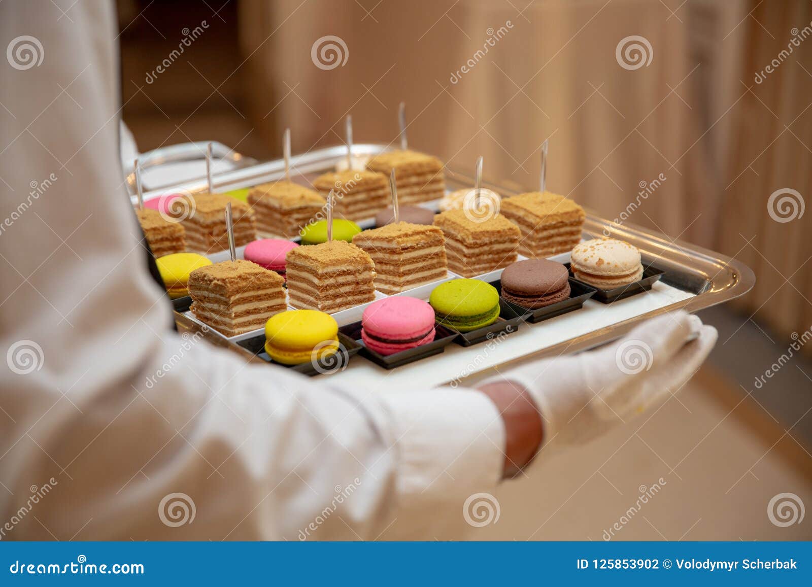 The Waiter Serves an Expensive Dessert of Macaroons. Macaroon in the ...