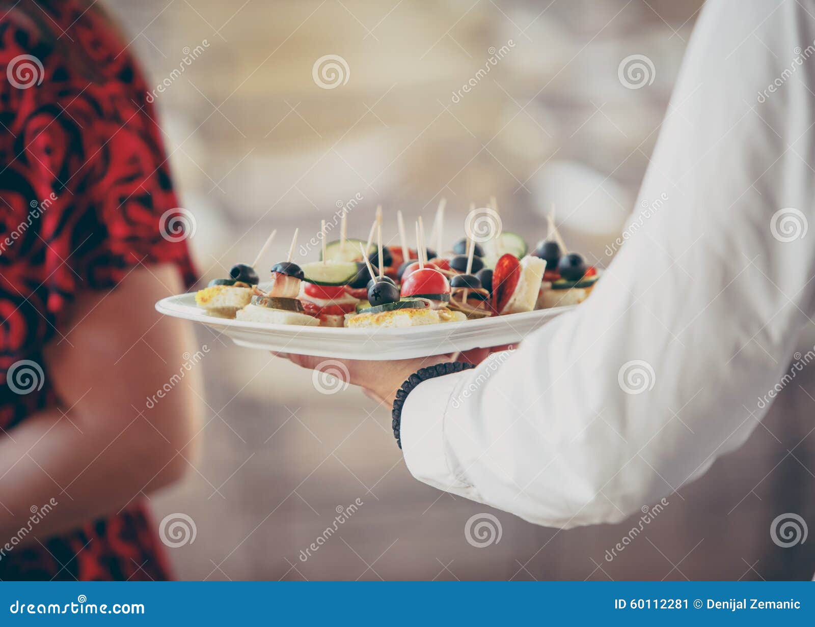 Waiter serving appetizers stock image. Image of dinner - 60112281