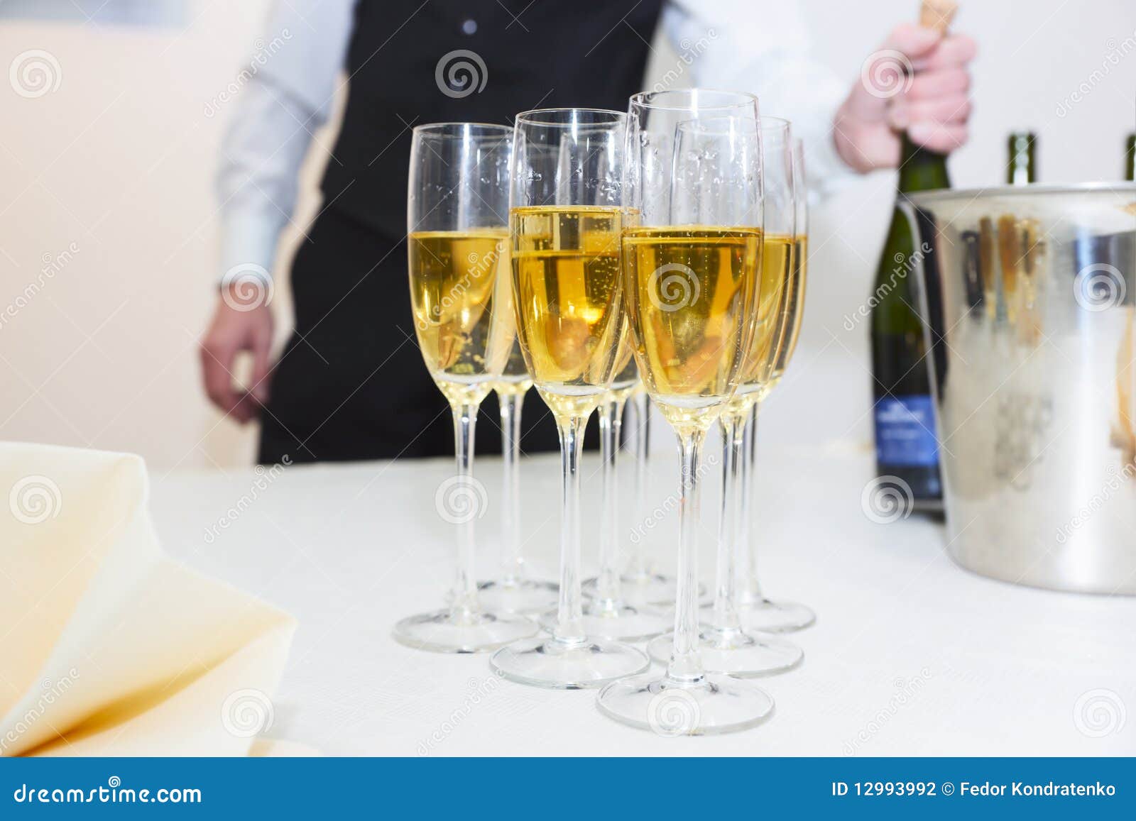Waiter serving champagne stock photo. Image of group - 12993992