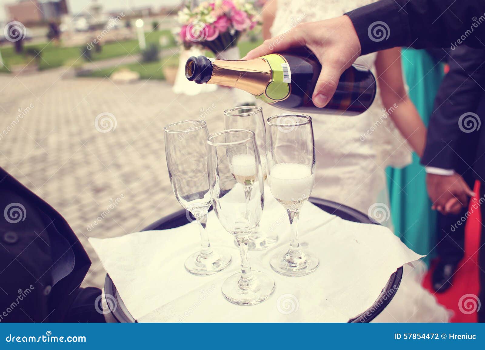 Waiter serving champagne stock photo. Image of sitting - 57854472