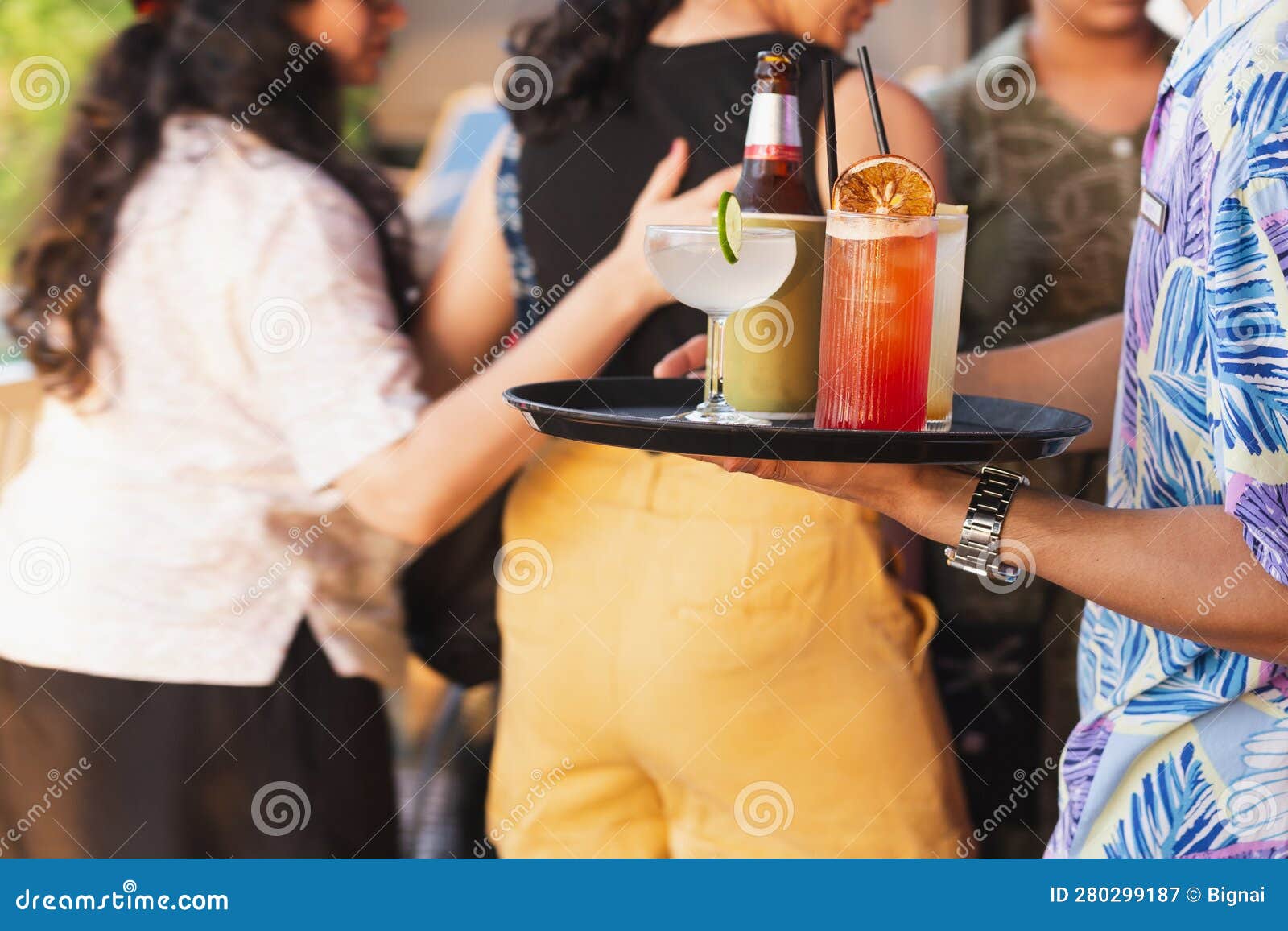 Waiter Serving Cocktail for Group of People Celebrating. Stock Image ...